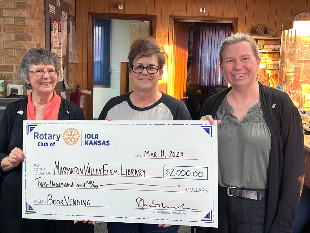 Rotary gives funds for book vending machine - The Iola Register